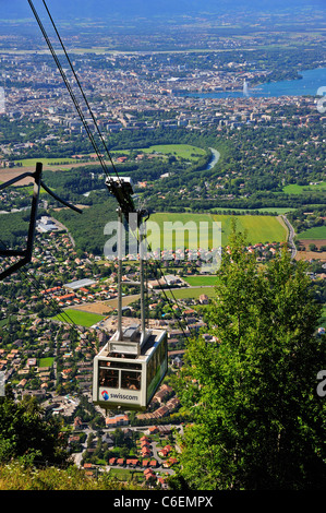 The Saleve cable car, France, with the city of Geneva in the background ...