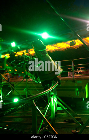 Riders on a roller coaster Stock Photo - Alamy