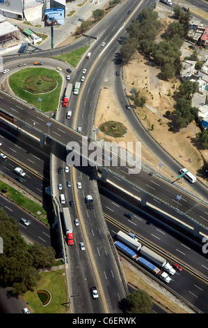 Aerial view of cars driving on round intersection in city ...