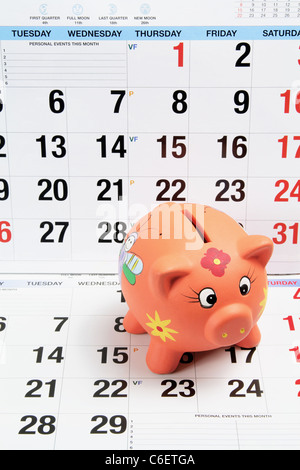 Money Investment Calendar And Piggy Bank. Finance Month Stock Photo - Alamy