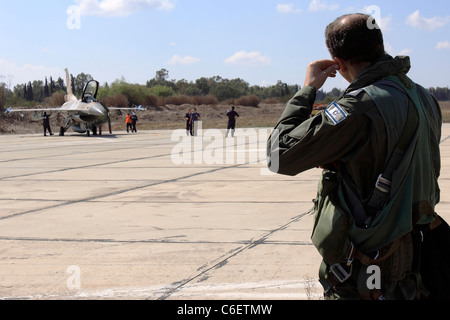 An Israeli pilot with a F-16 fighter jet in a hangar at Hatzor Israeli ...