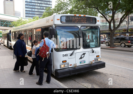 Passengers board a bus in downtown Vancouver, Friday, November, 1, 2019 ...