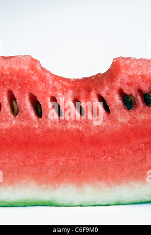 Sliced of watermelon with a bite taken out, isolated on white ...