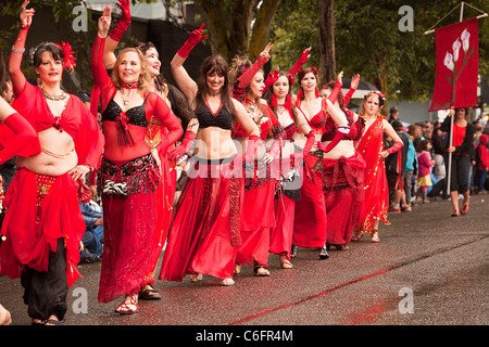 Belly dancer woman in red isolated on white Stock Photo - Alamy