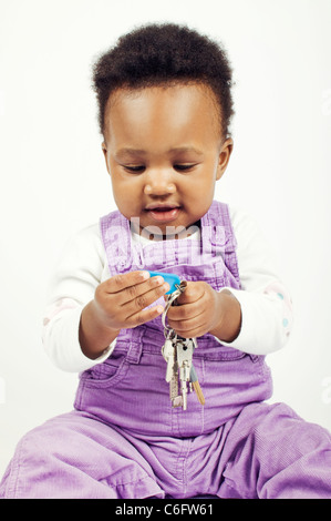 Baby girl (1-2) playing with bunch of keys Stock Photo - Alamy