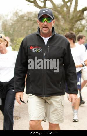 Cricket legend Sir Ian Botham, right, chats with former England cricket ...