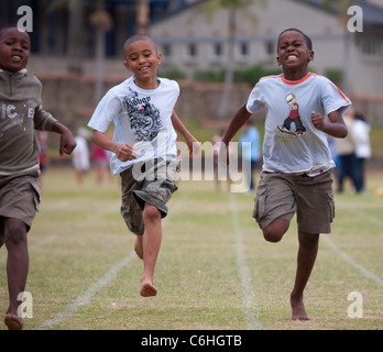 Primary school children running in inter-house athletics race Stock ...