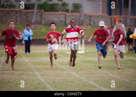 Primary school children running in inter-house athletics race Stock ...