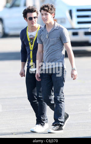 Kevin Jonas and Nick Jonas Jonas Brothers playing American football ...