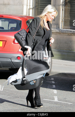 Jennifer Ellison carrying her son Bobby in a baby carrier while out and ...