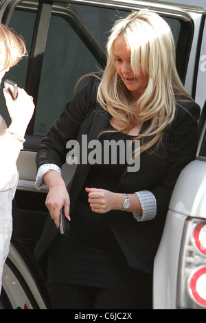 Jennifer Ellison carrying her son Bobby in a baby carrier while out and ...