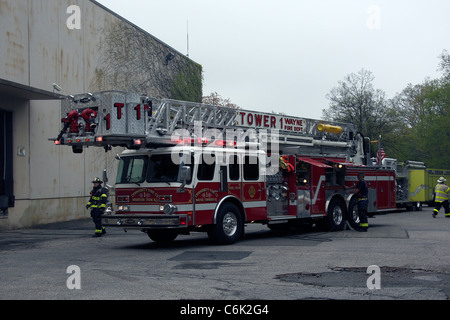 Tower ladder fire truck rear view with flag Manhattan New York USA ...