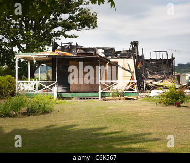 The charred remains of the burned out home are seen in Malibu, Calif ...