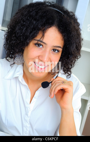 African american curly call center agent woman working using headset ...