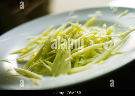 Close up shot of sliced mango served with lemon on a plastic cup Stock ...