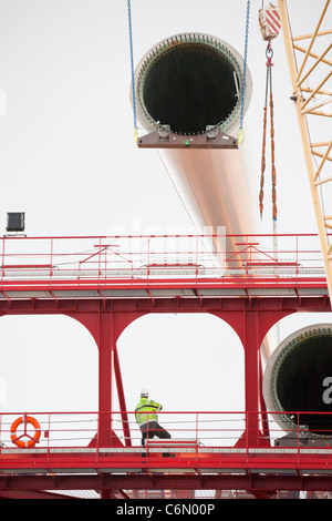 Wind turbine blades on a jack up barge constructing the Walney offshore ...