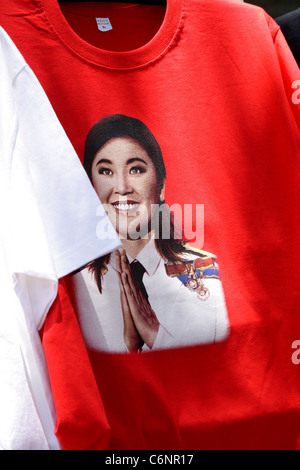 Thai Prime Minister Yingluck Shinawatra gets out of her car before ...