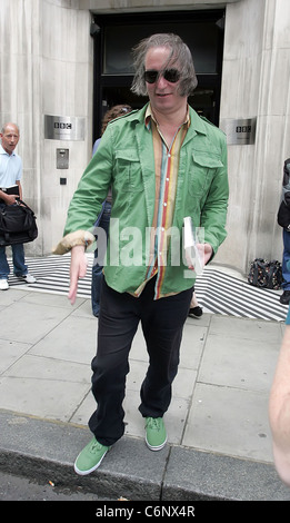 REM guitarist Peter Buck leaving the BBC Radio Two studios where he was ...