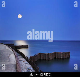 Scenic moonlit landscape with a tranquil lake, mountains, and a clear ...