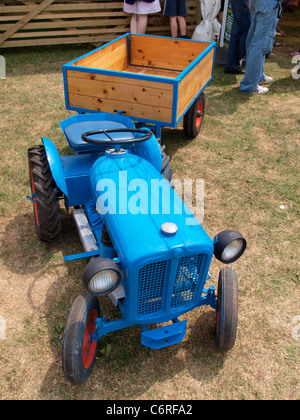 a scale model of blue farm tractor Stock Photo - Alamy