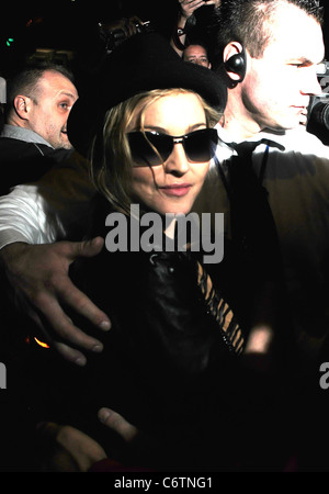 Madonna is escorted out of Aura night club by her personal bodyguard ...