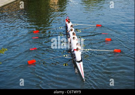 Crew rowers practice rowing in an 8 / eight person scull on the Stock ...