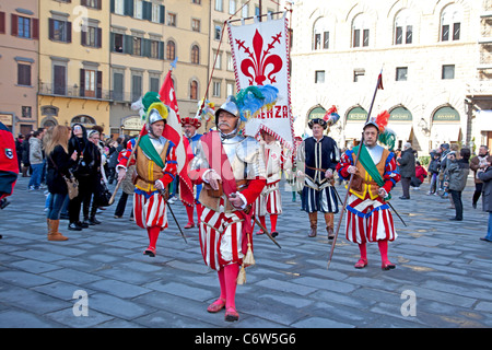 Parade by men in traditional costume through the streets of Florence ...