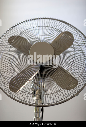 Silver metal floor ventilation fan on the white floor at home or ...