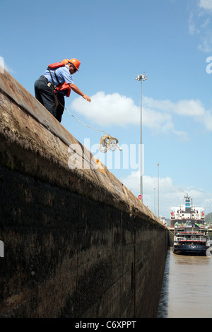 Workers for the Panama Canal handling lines at the Gatun Locks on the ...