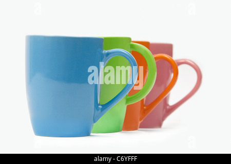 Colourful mugs in a row Stock Photo - Alamy