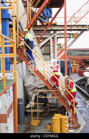 oil drilling rig with workers Stock Photo - Alamy
