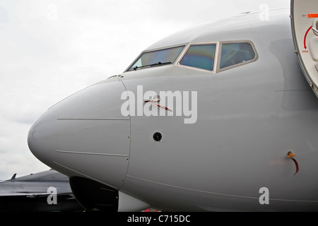 Cockpit and nose of the aircraft close up in a hangar on the service ...