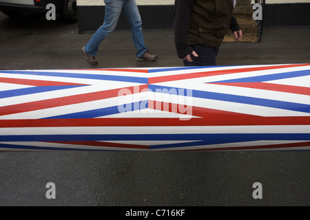 The newly decorated Maypole being put back into position at the center ...