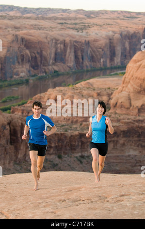 Man barefoot running on sandstone, Moab, Utah Stock Photo - Alamy