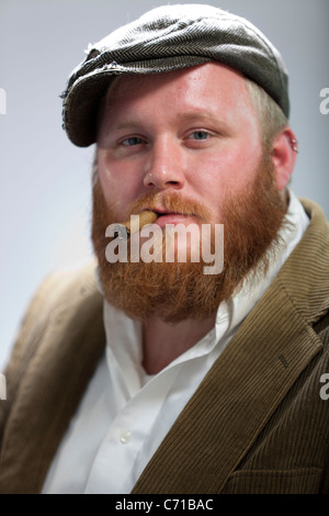 Portrait of a man as a rough-around-the-edges character Stock Photo - Alamy