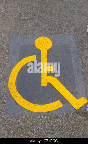 yellow wheelchair handicap road sign painted on a pavement Stock Photo ...