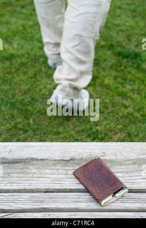 Wallet left on park bench Stock Photo - Alamy