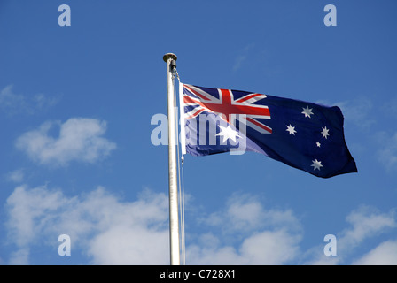 The flag of Australia is a defaced Blue Ensign, a blue field with a ...