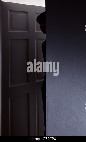 Sinister male lurking in the dark Stock Photo - Alamy