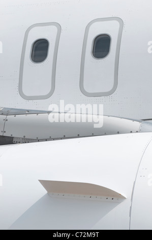 Windows of an airplane outside. White color plane. Vertical image Stock ...