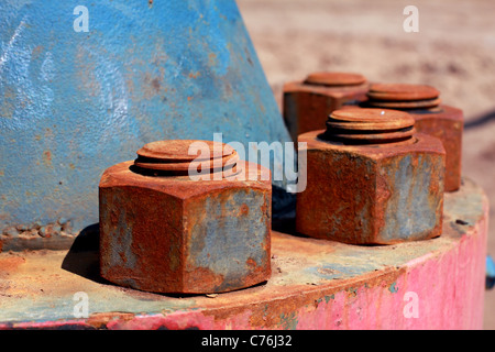 Painted iron surface with a large rusty, black spot and metal corrosion ...