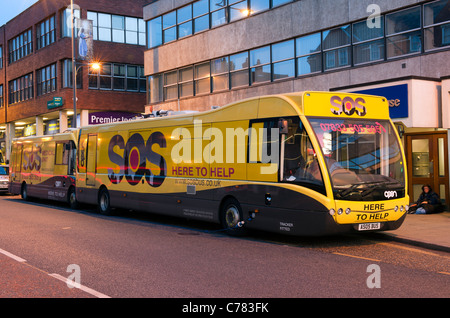 SOS bus in Norwich city cente at night Stock Photo - Alamy
