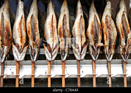 Steckerlfisch (grilled fish on a stick) - traditional meal seen on ...