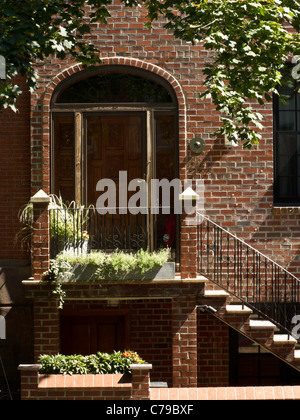 Entrance stairs to brick brownstone building. Architectural exterior ...