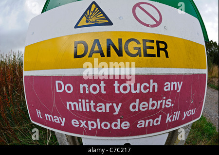 Warning notice sign Danger Unexploded ordnance on this beach it may ...