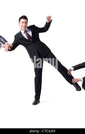 Portrait of a Businessman Pulled in All Directions Stock Photo - Alamy