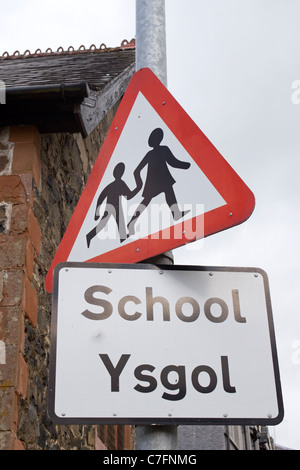 Bilingual sign school ysgol welsh English warning triangle sign Stock ...