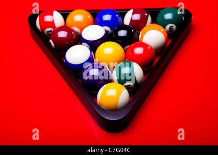 Billiard balls isolated on red Stock Photo - Alamy