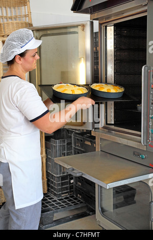 Young Pastry Chef Making Some Croissant in the Bakery Cooking Process ...
