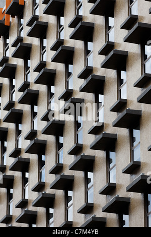 Diagonal view of modern new apartment building facade with gray and ...
